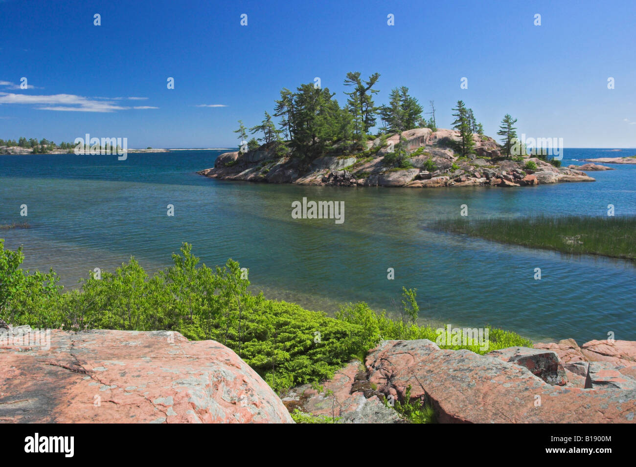 Granite cliffs and White pines typify the landscape in Killarney ...