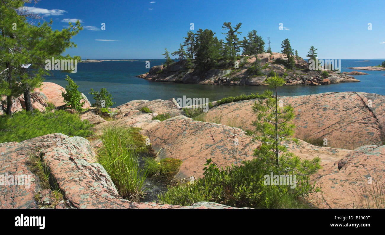 Granite cliffs and White pines typify the landscape in Killarney ...
