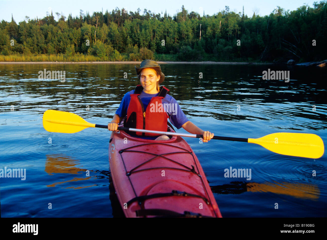 female kayaking at Nutimik Lake, Whiteshell Provincial Park, Manitoba ...