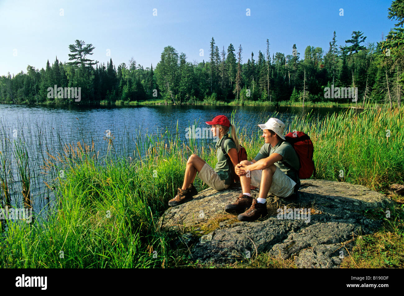 Teenage hikers at Lyons Lake, Whiteshell Provincial Park, Manitoba ...
