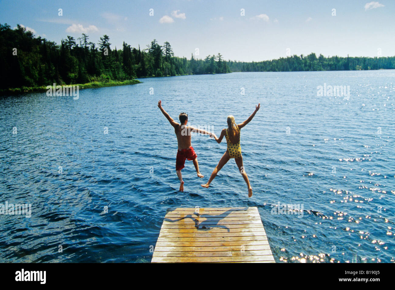 Jumping off dock, Lyons Lake, Whiteshell Provincial Park, Manitoba ...