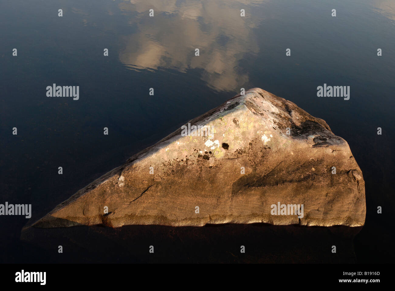 Boulder in lochan near Poca Buidhe Flowerdale forest Scotland Stock ...
