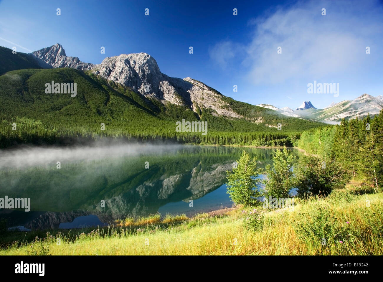Mount Kid reflected in Wedge Pond, Kananaskis Provincial Park, Alberta ...