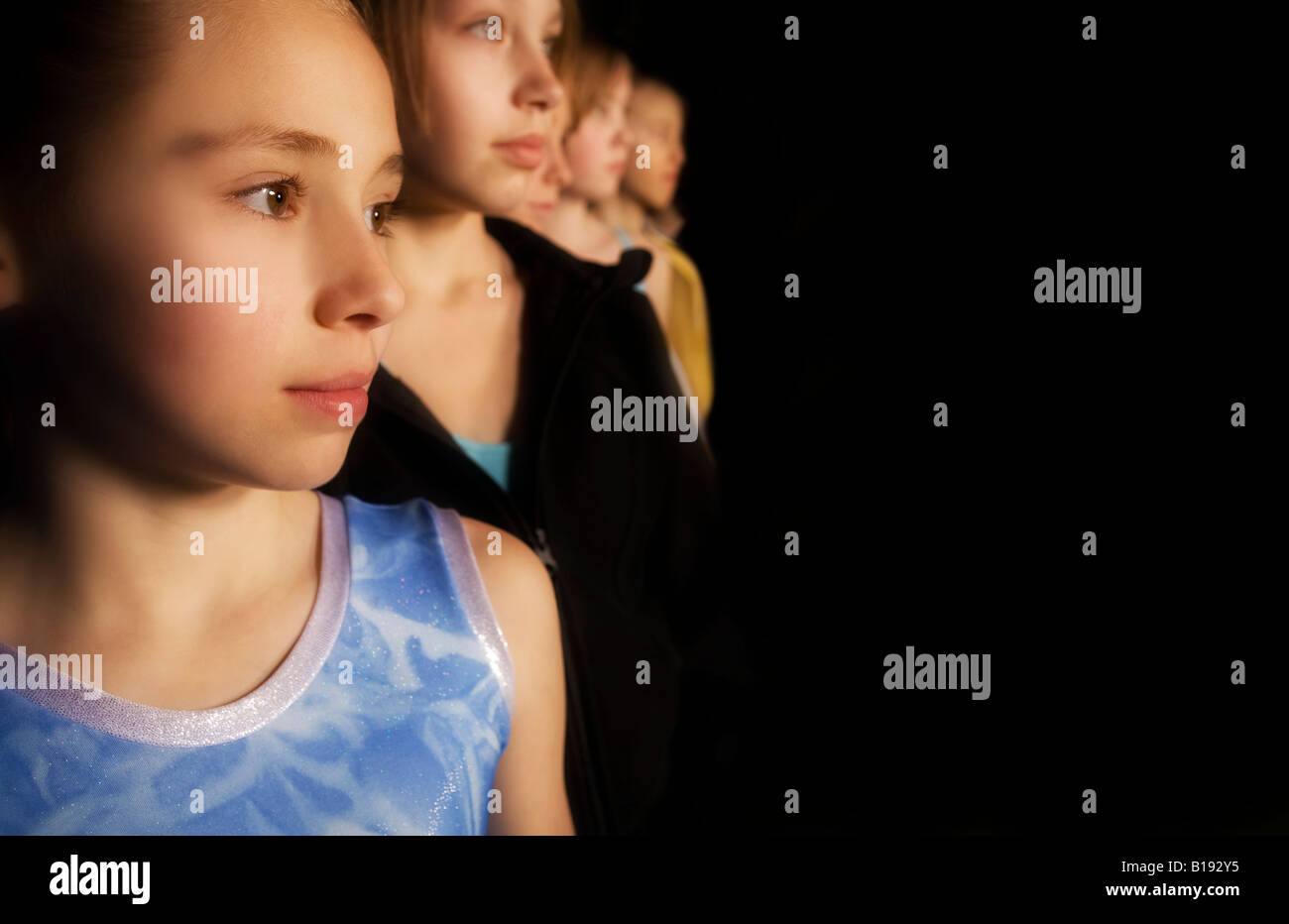 Girls standing in a line Stock Photo - Alamy