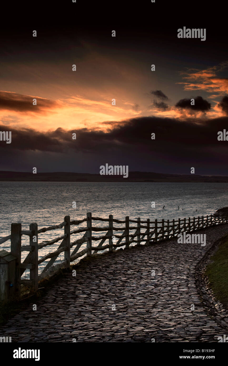 A stone path along the water, Holy Island, Berwick, Northumberland ...