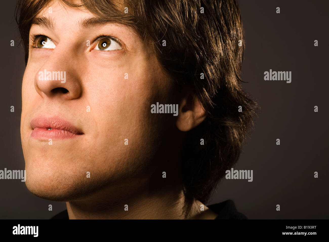 Man looking upwards Stock Photo - Alamy