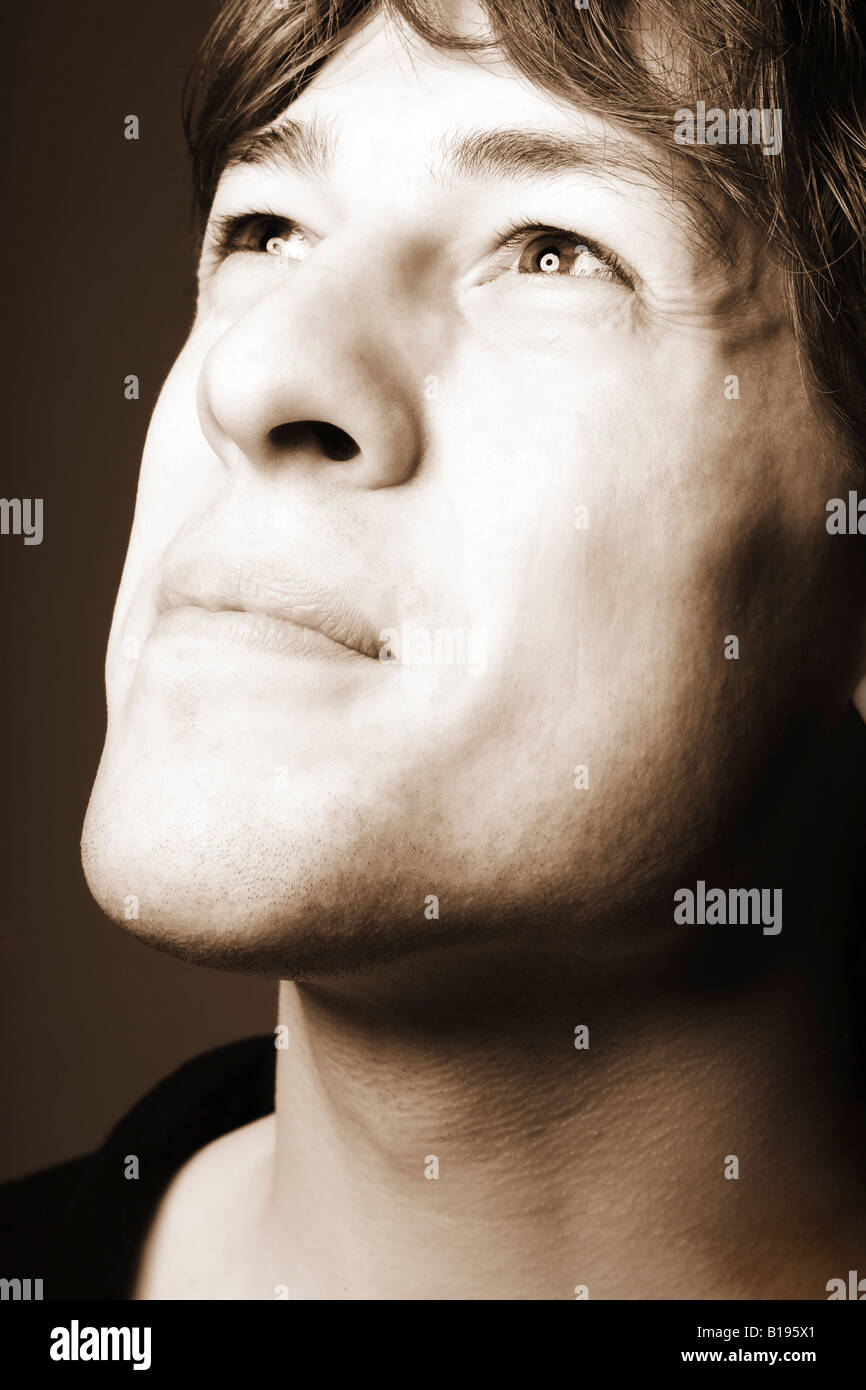 Man looking upwards Stock Photo - Alamy