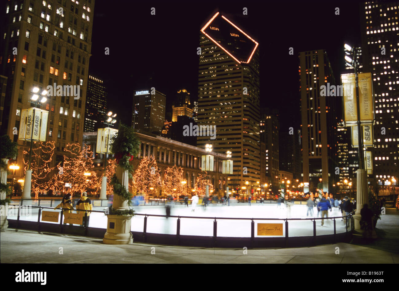 SKATING Chicago Illinois Ice skaters at Millennium Park ice rink winter ...