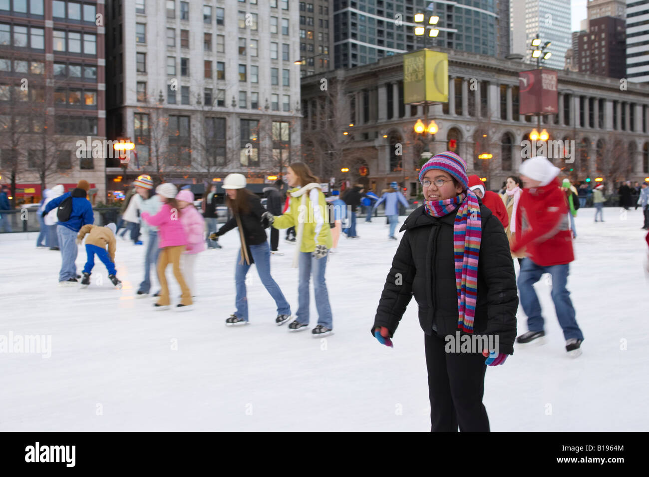 SKATING Chicago Illinois Ice skaters at Millennium Park ice rink winter ...