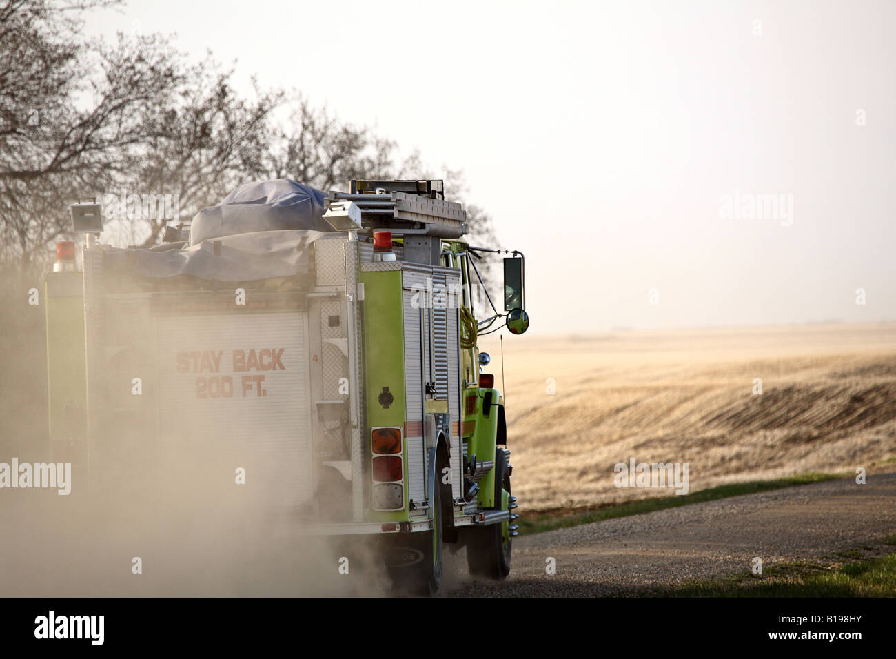 Fire truck throwing up dust Stock Photo - Alamy