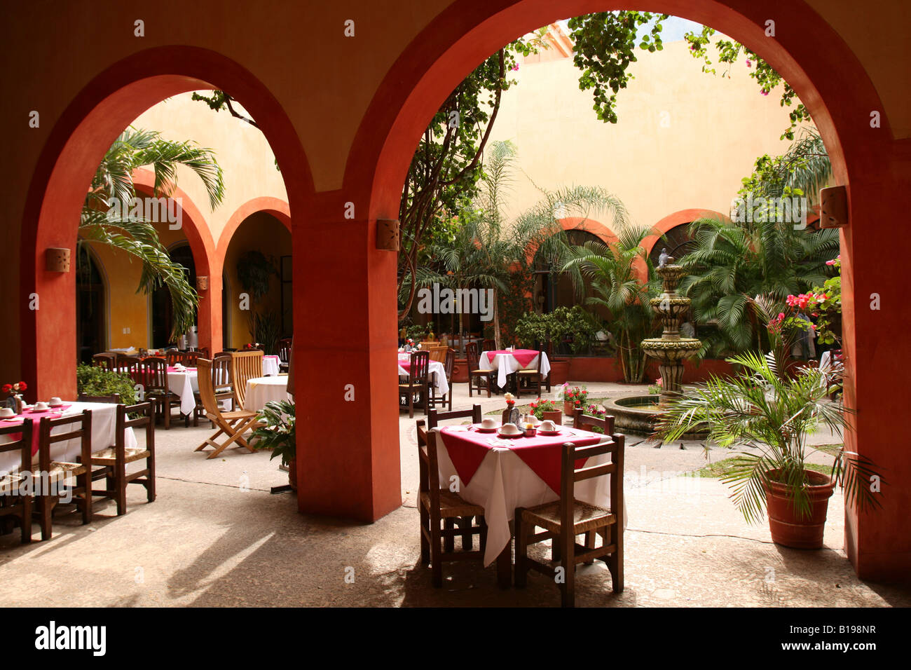Restaurant in interior courtyard of Mazatlan hotel, Mazatlan, Mexico ...