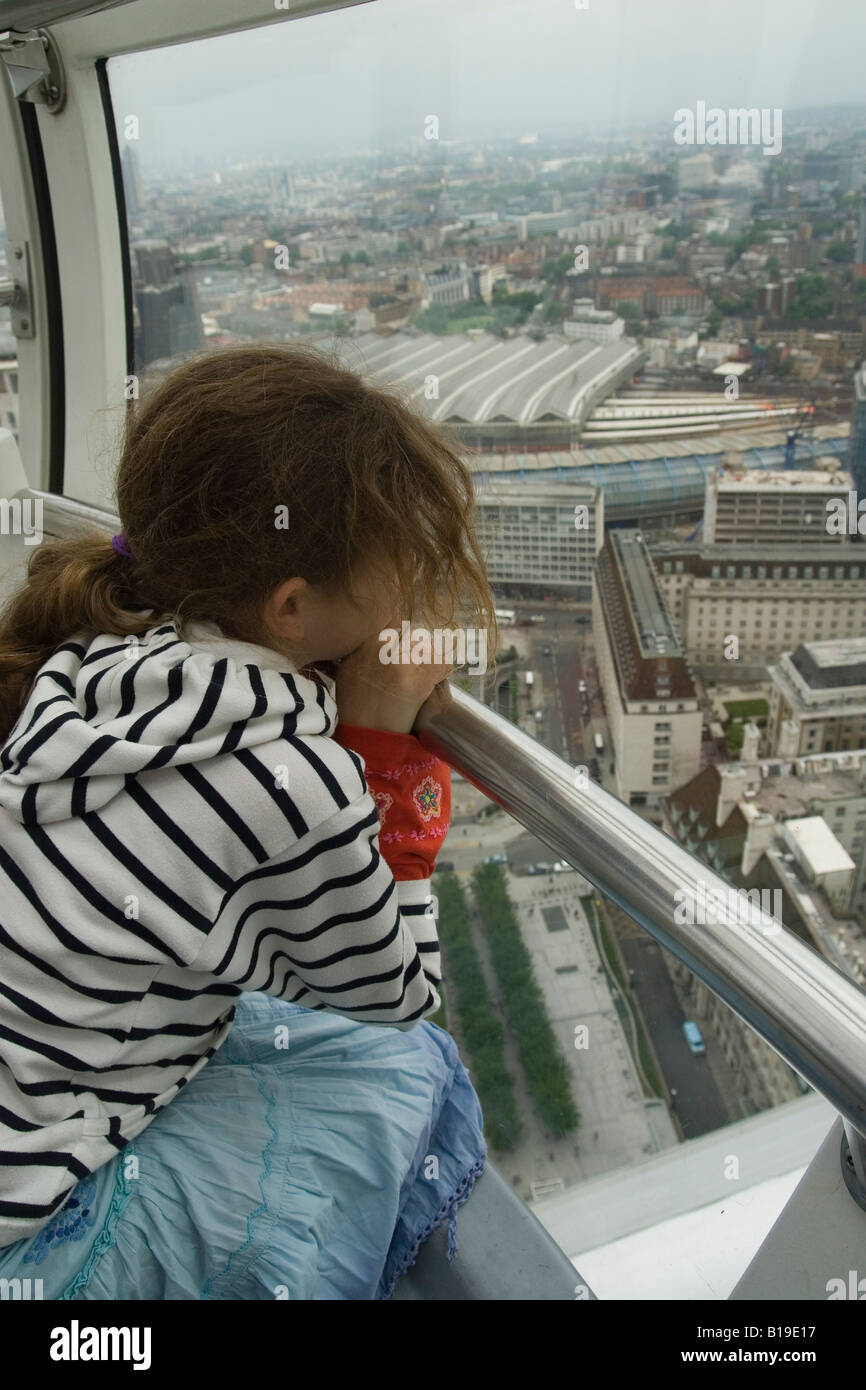 girl gazing out from london eye pod Stock Photo - Alamy