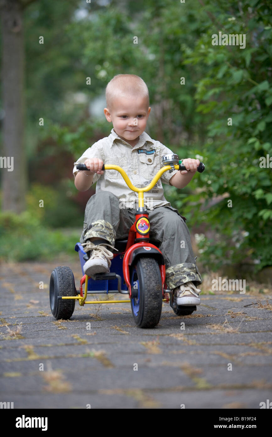 Blond toddler on a toy bike Stock Photo - Alamy