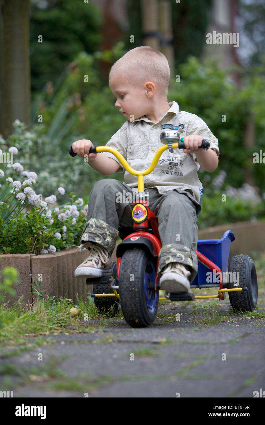 Blond toddler on a toy bike Stock Photo - Alamy