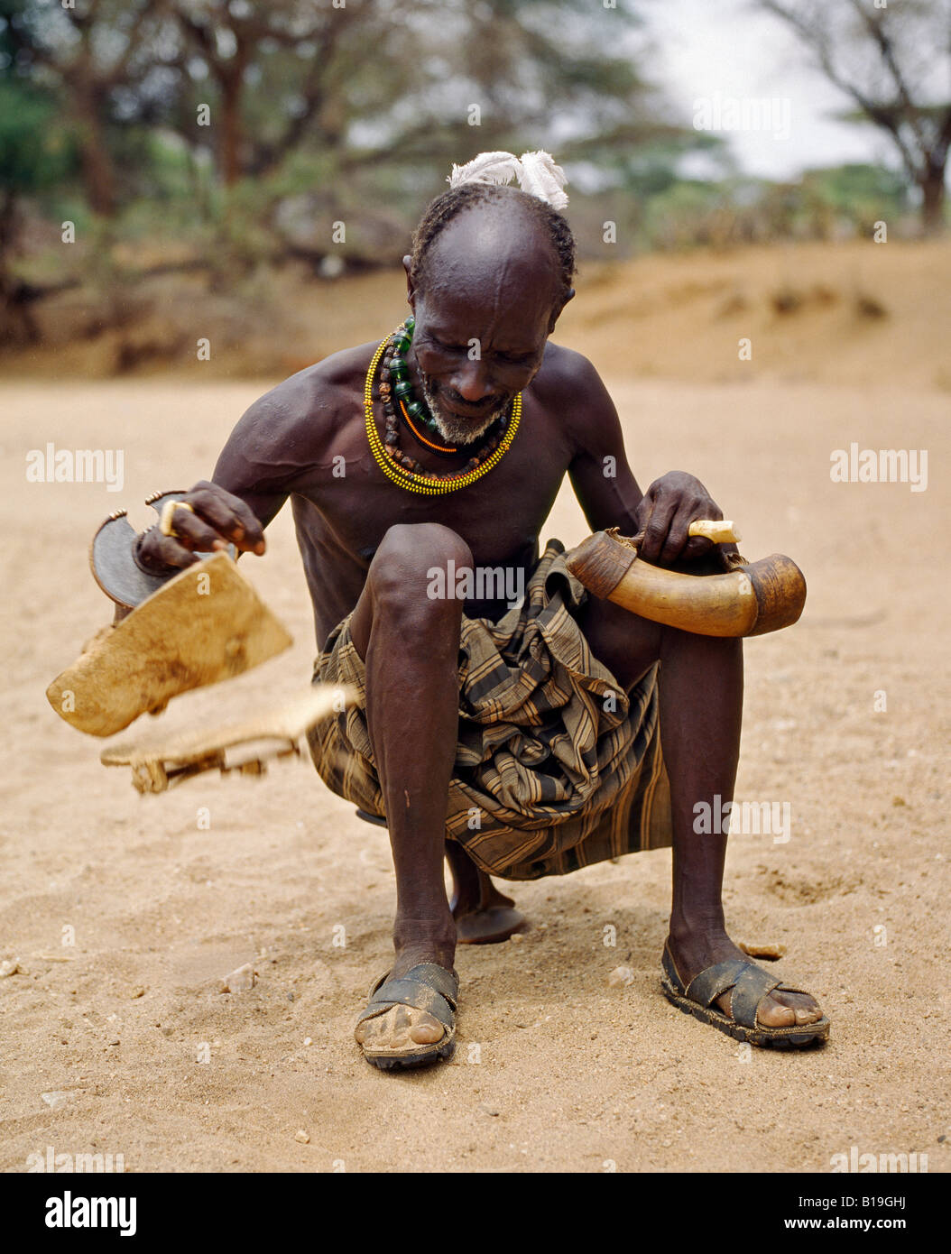 Kenya, Rift Valley Province, Kapedo. A Turkana soothsayer foretells the ...