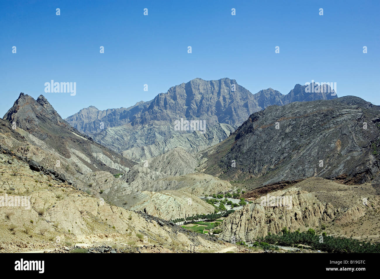 Oman, Western Hajar Mountains. West of the coastal areas lies the ...