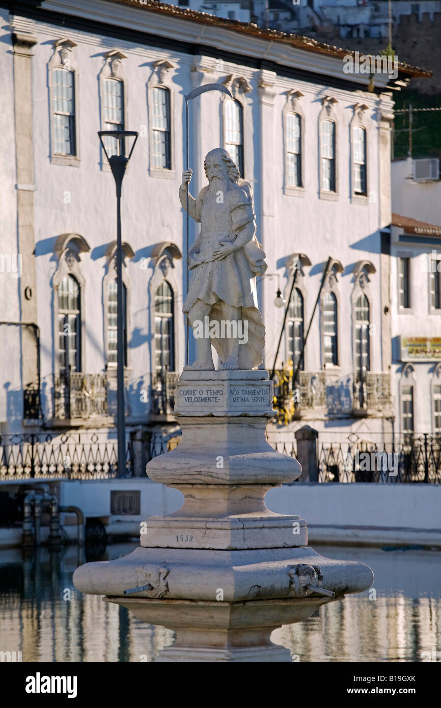 Portugal, Alentejo, Estremoz. A white marble statue at sunset in the ...