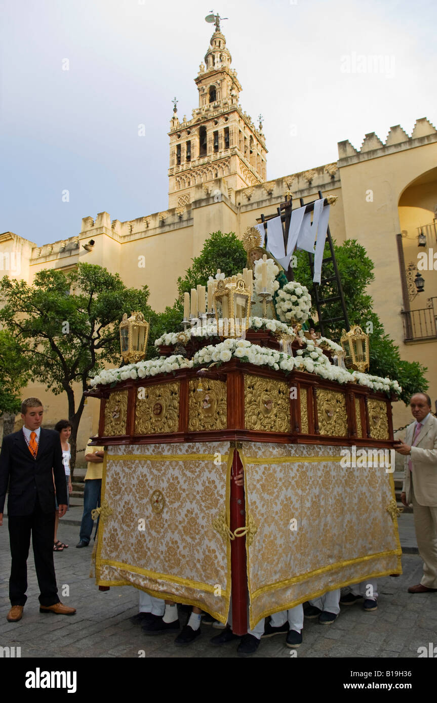 Spain, Andalucia, Seville. A procession past the Cathedral by one of ...