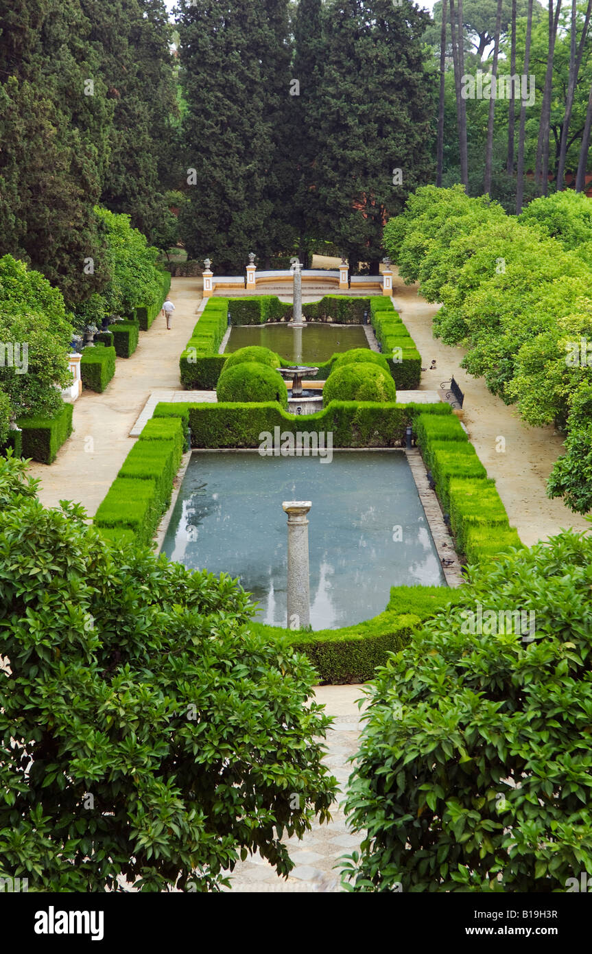 Spain, Andalucia, Seville. Topiaried hedges and formal walkways ...