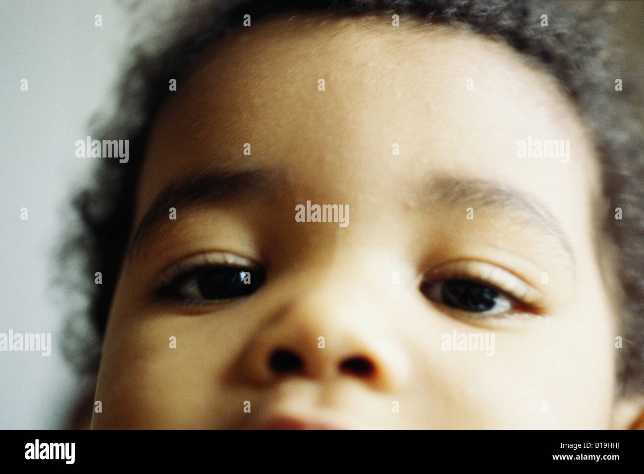 Child looking at camera, close-up of face, cropped Stock Photo - Alamy