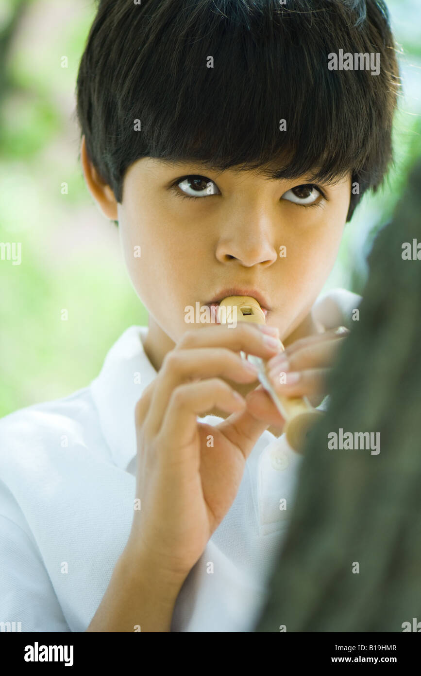 Boy playing recorder, close-up Stock Photo - Alamy