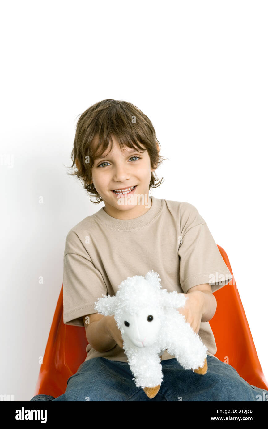 Boy holding plush toy lamb hi-res stock photography and images - Alamy