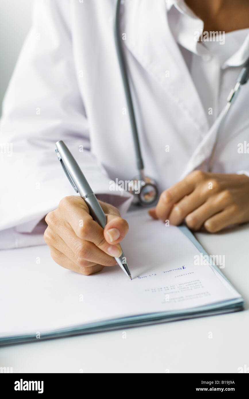 Doctor writing prescription, cropped view Stock Photo - Alamy