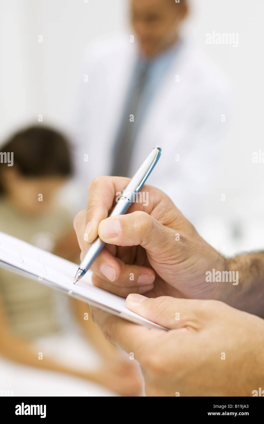 Man's hands writing on tablet, close-up, cropped view Stock Photo - Alamy
