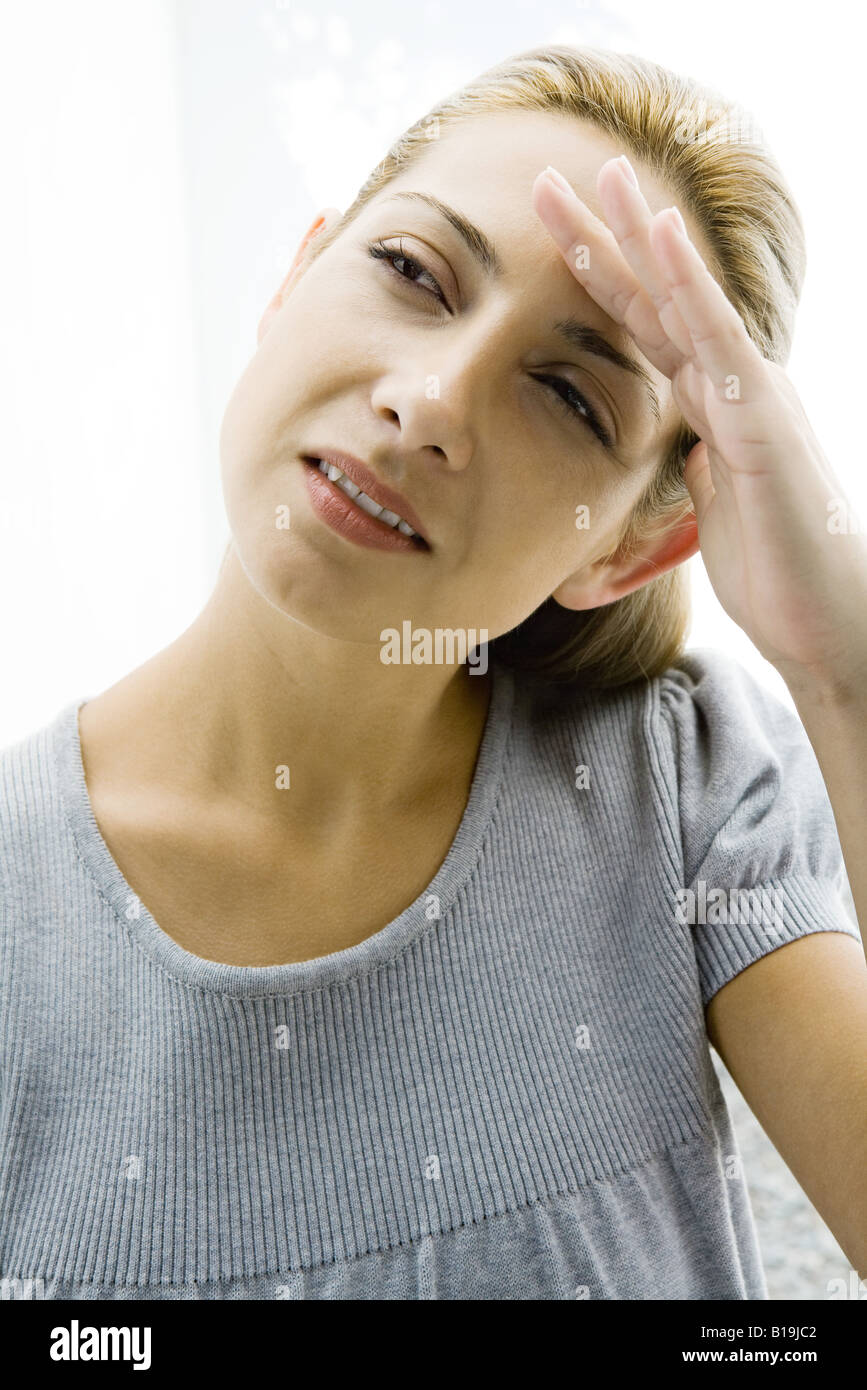 Woman shading her eyes, looking up, portrait Stock Photo - Alamy