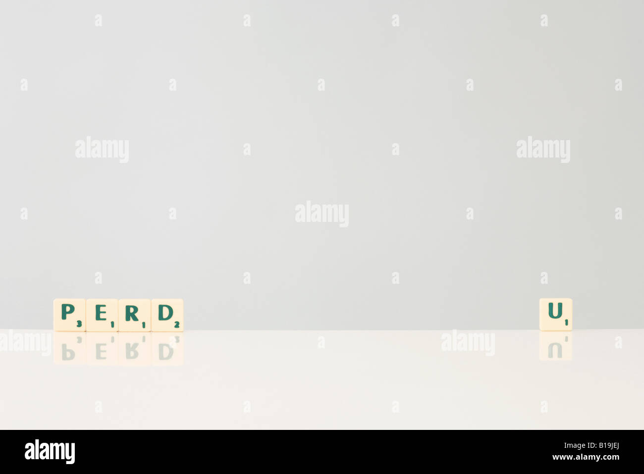 Spelling out words with scrabble tiles hi-res stock photography and ...