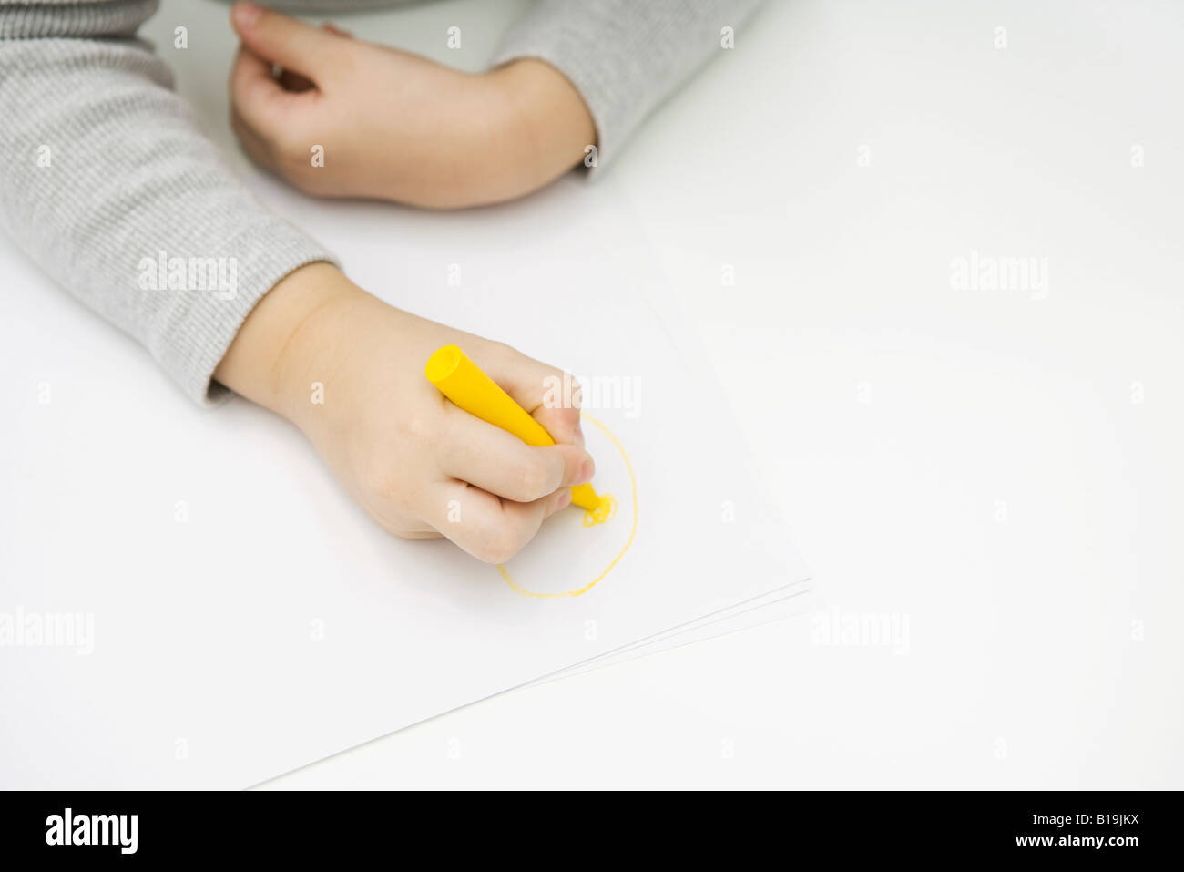 Hand holding crayon coloring hi-res stock photography and images - Alamy