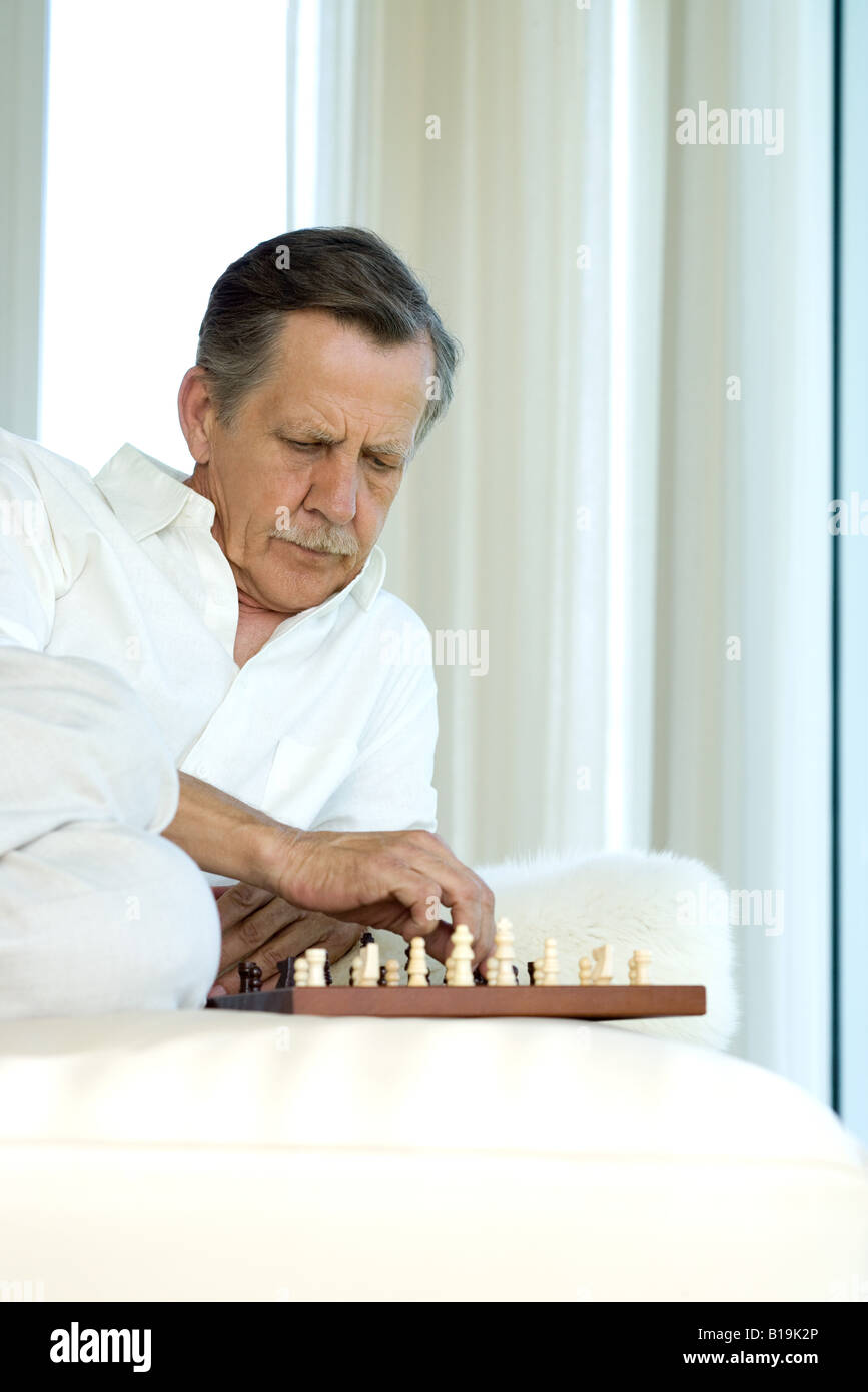 Man playing chess Stock Photo - Alamy