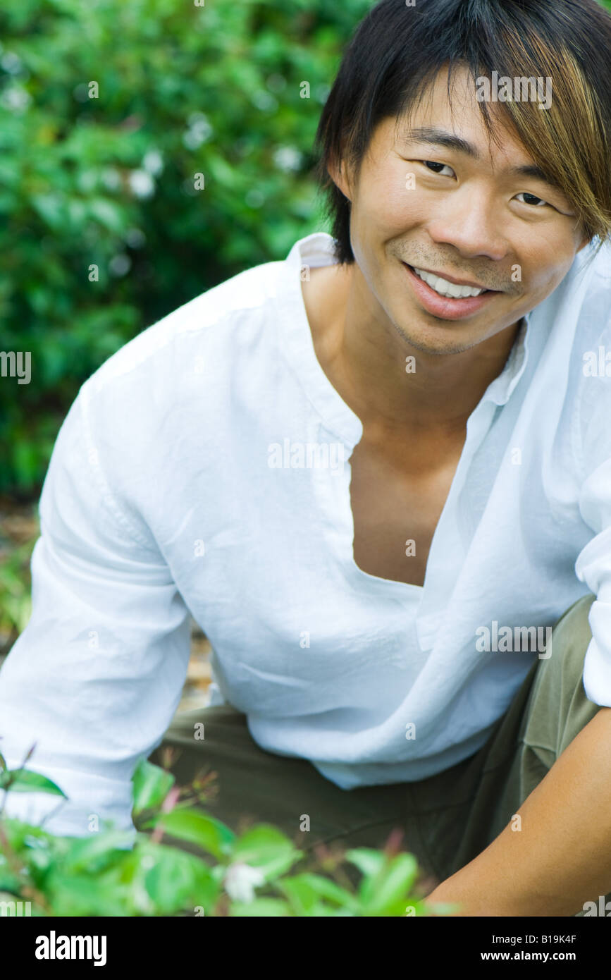 Man in garden, smiling at camera, portrait Stock Photo - Alamy