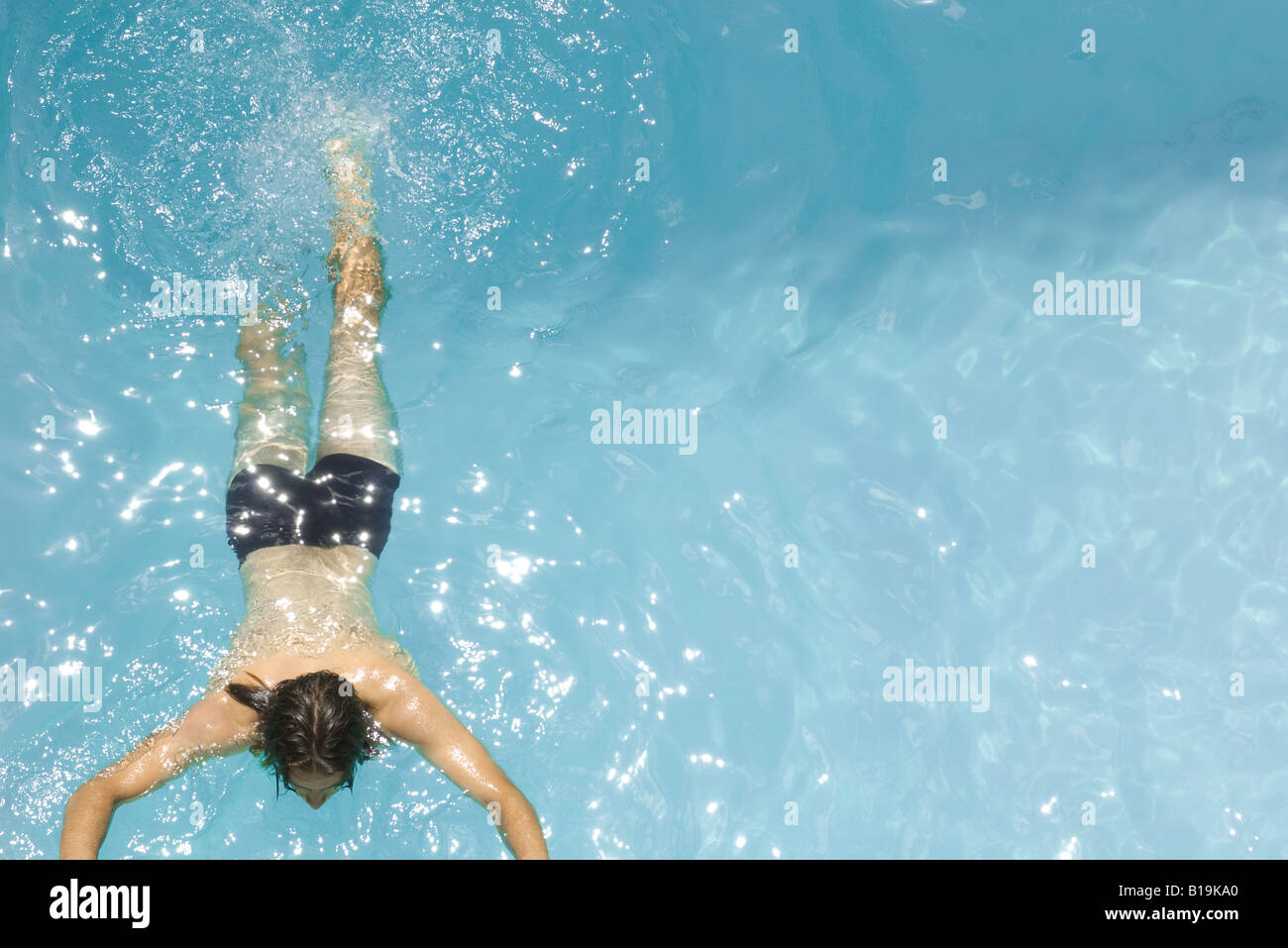 Man swimming in pool, high angle view Stock Photo - Alamy