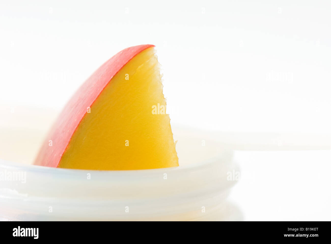 Mango slice in small jar, close-up Stock Photo - Alamy