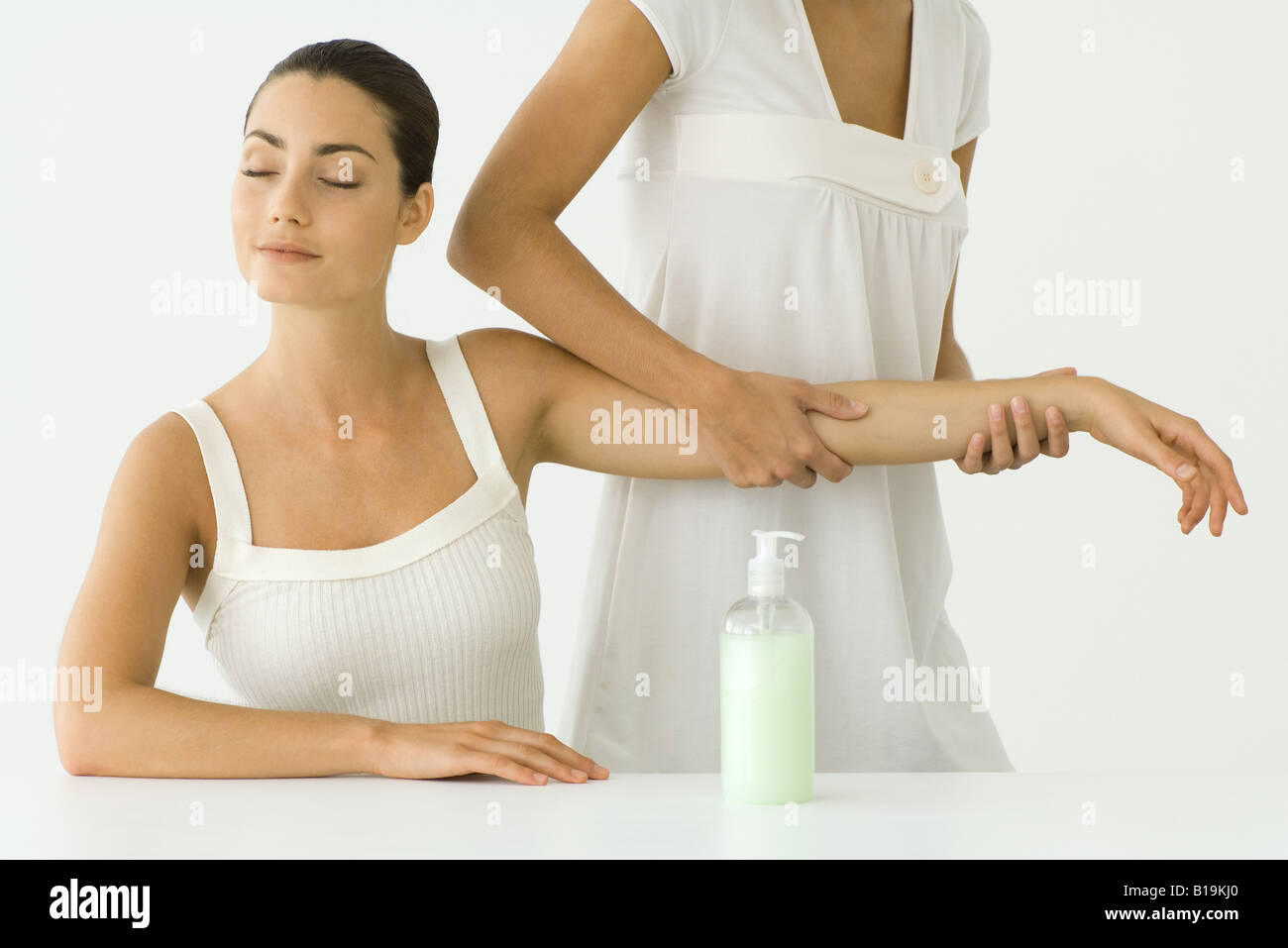 Woman receiving arm massage, eyes closed Stock Photo - Alamy