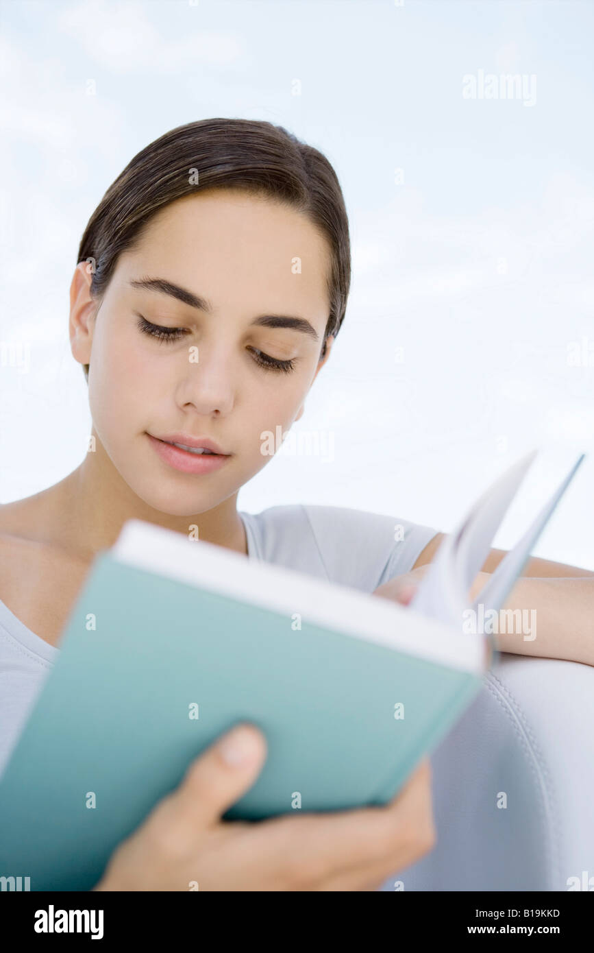 Female reading book, close-up Stock Photo - Alamy