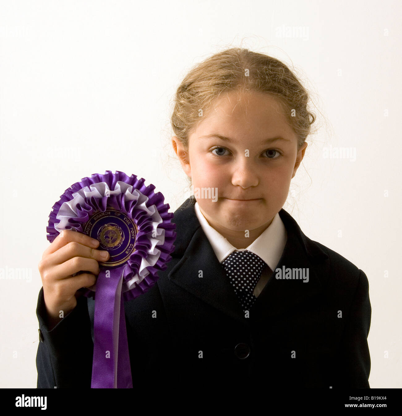 Girl with Pony Club Rosette Stock Photo - Alamy