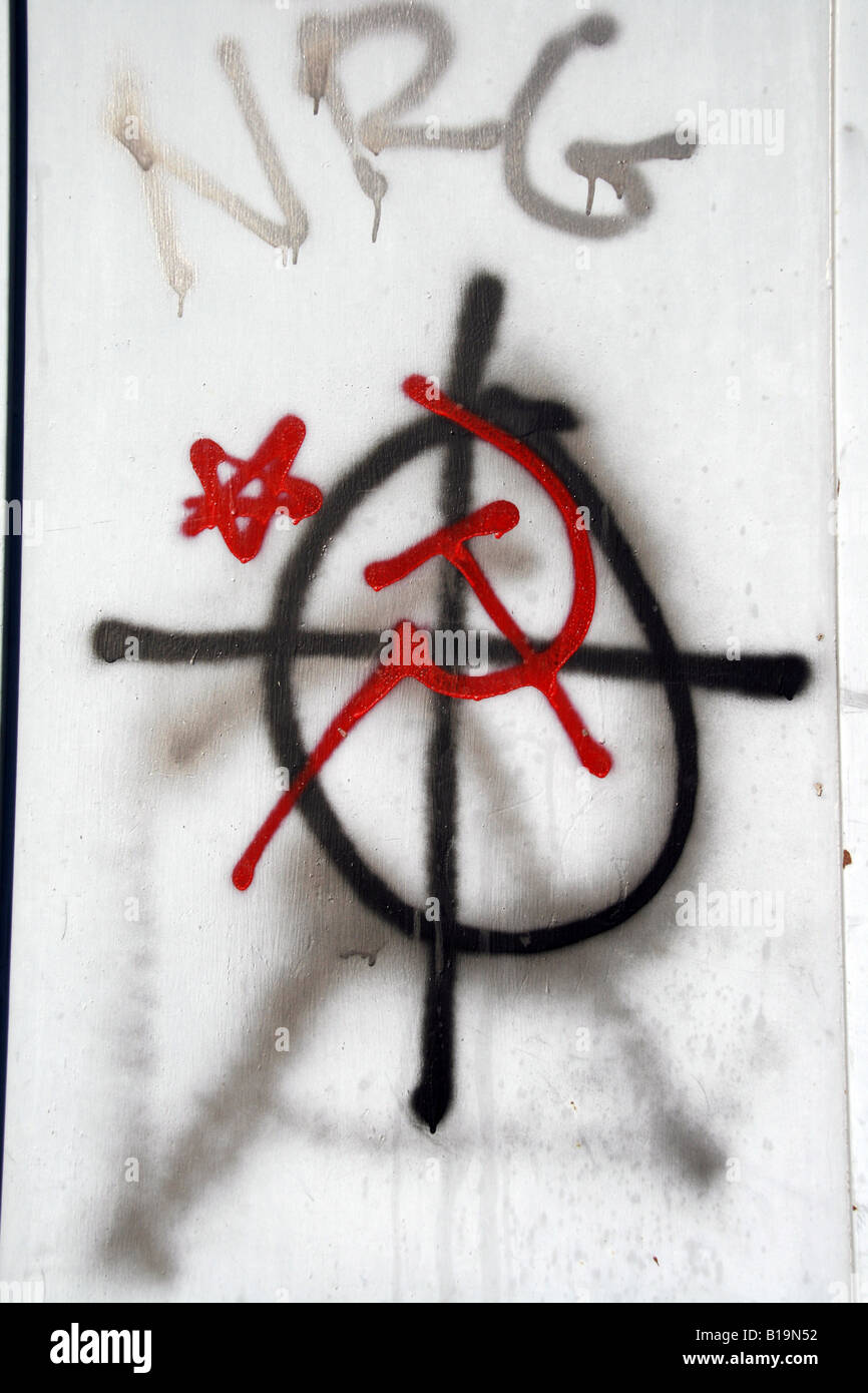 one hammer and sickle and celtic cross on wall Stock Photo - Alamy