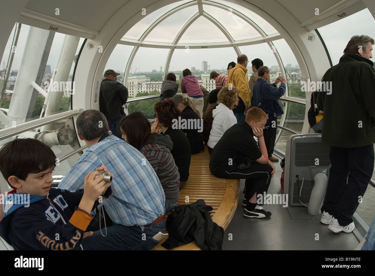 Tourists inside London Eye Pod Stock Photo - Alamy