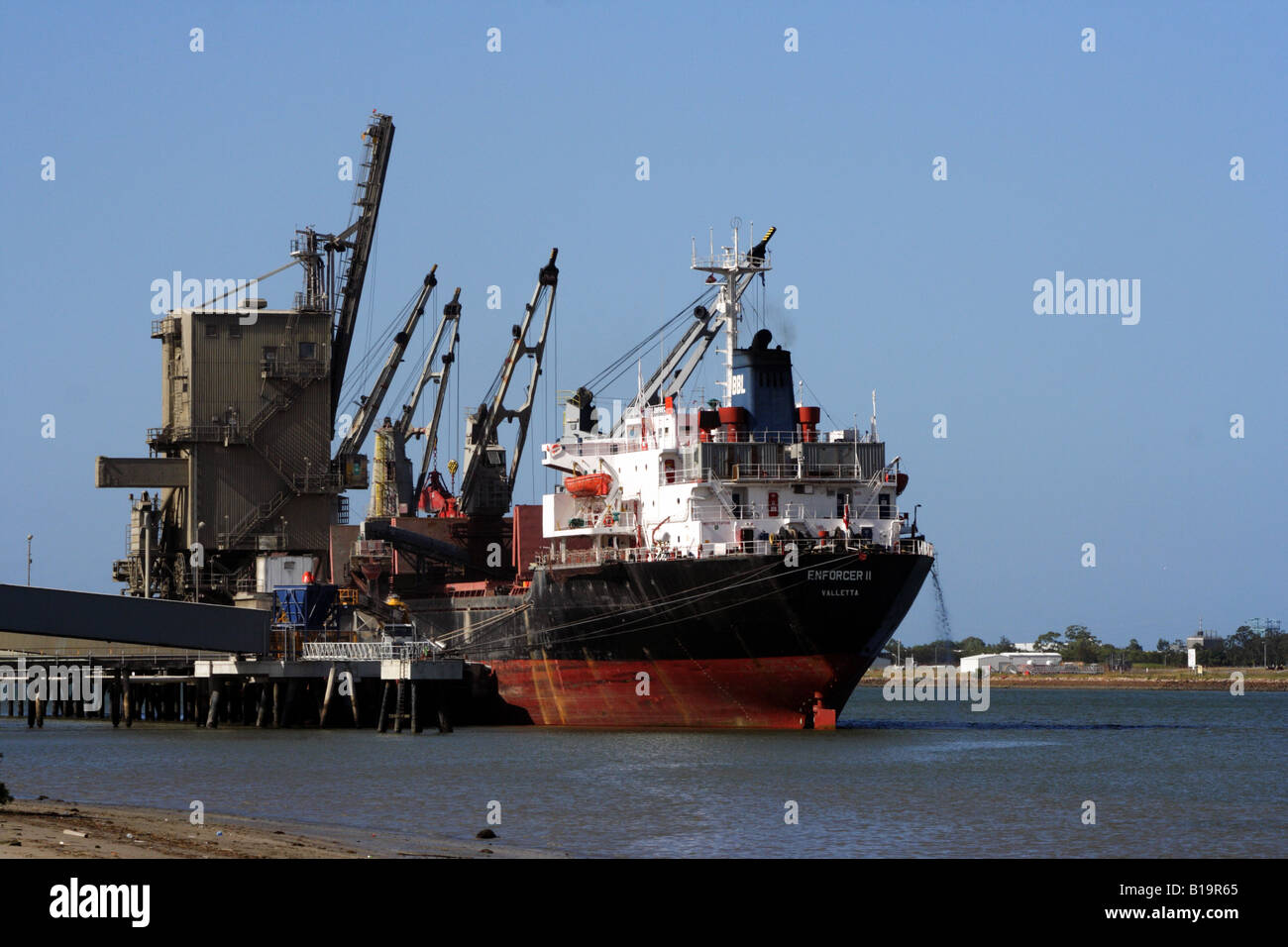 A CARGO SHIP LOADING AT A DOCK IN BRISBANE AUSTRALIA HORIZONTAL ...