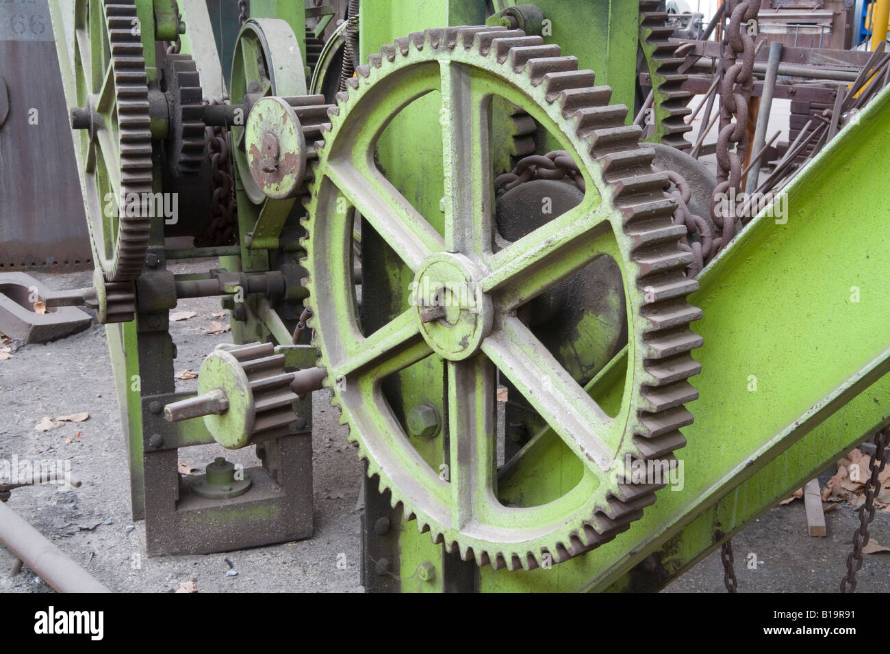 old run down industrial plant machinery showing cogs and gear wheels ...