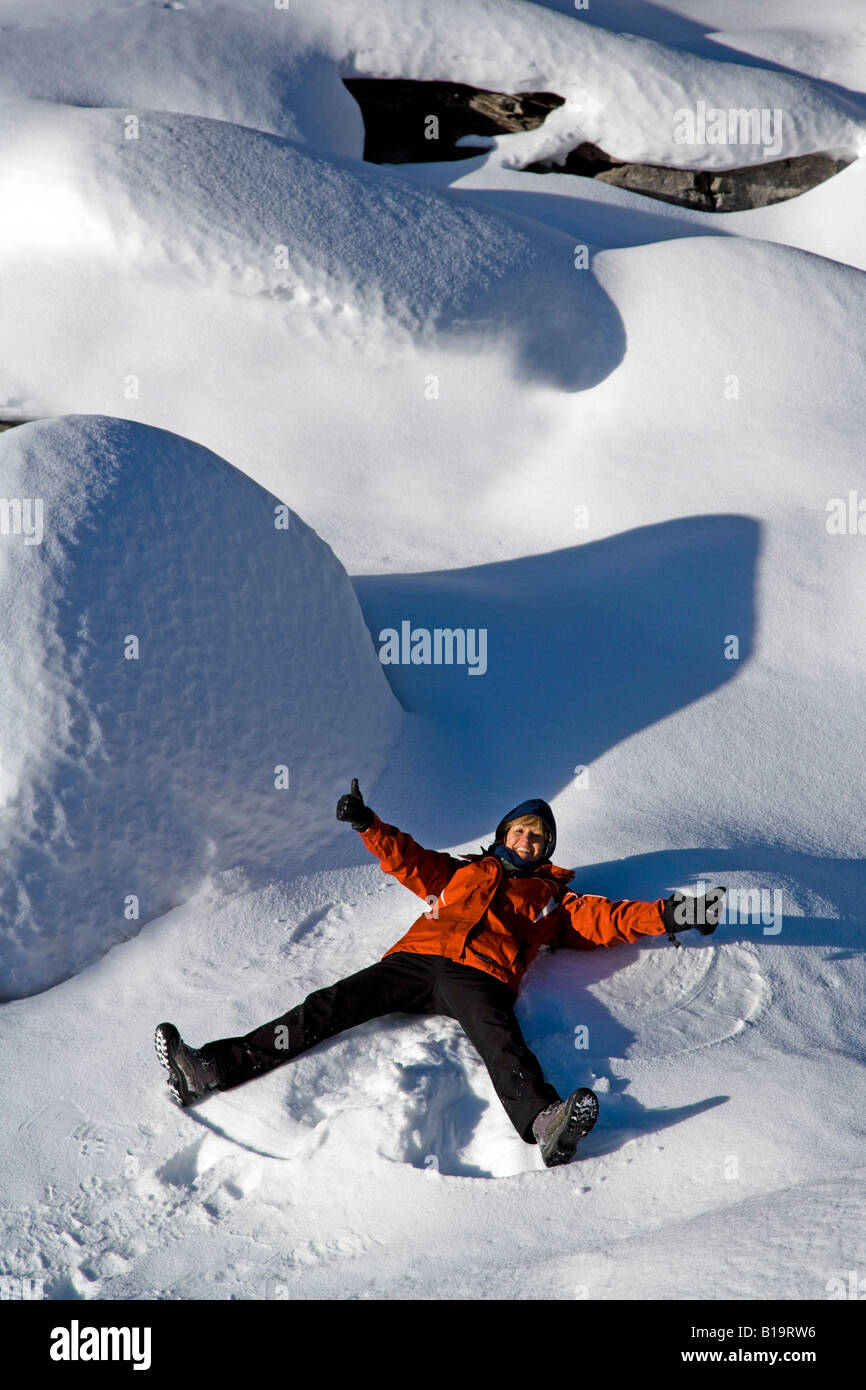 Person making snow angels Stock Photo - Alamy