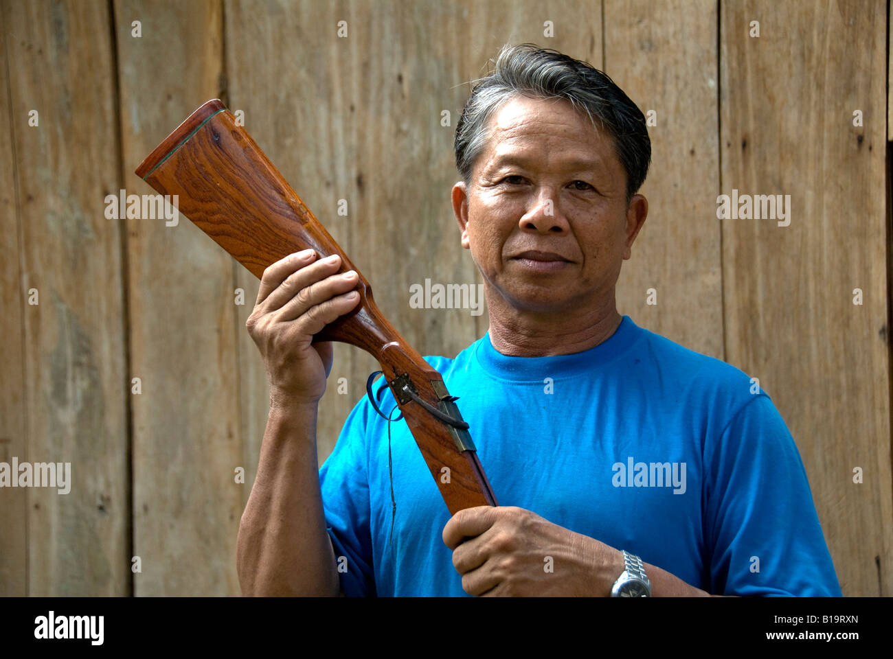 Gunsmith with a rifle he s made Stock Photo - Alamy