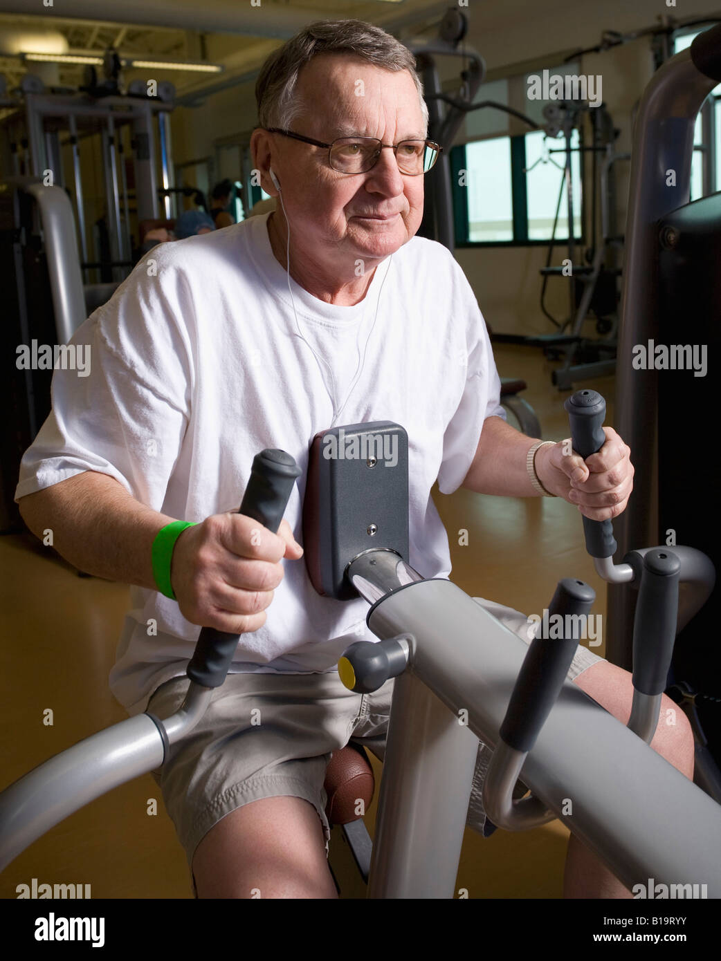 Man on a workout machine Stock Photo - Alamy