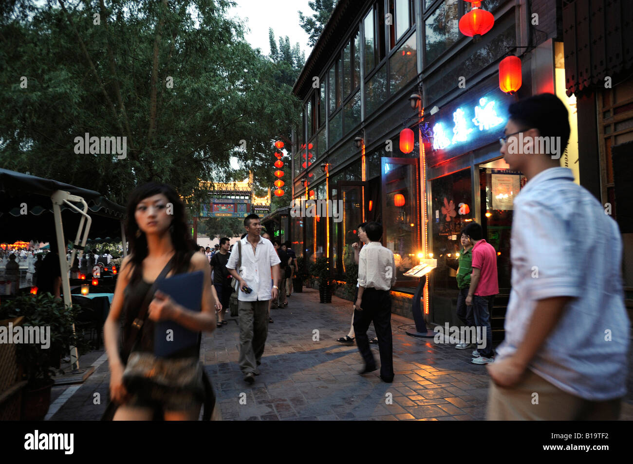 Tourists walk past restaurants at Lake Houhai in Night Beijing China ...