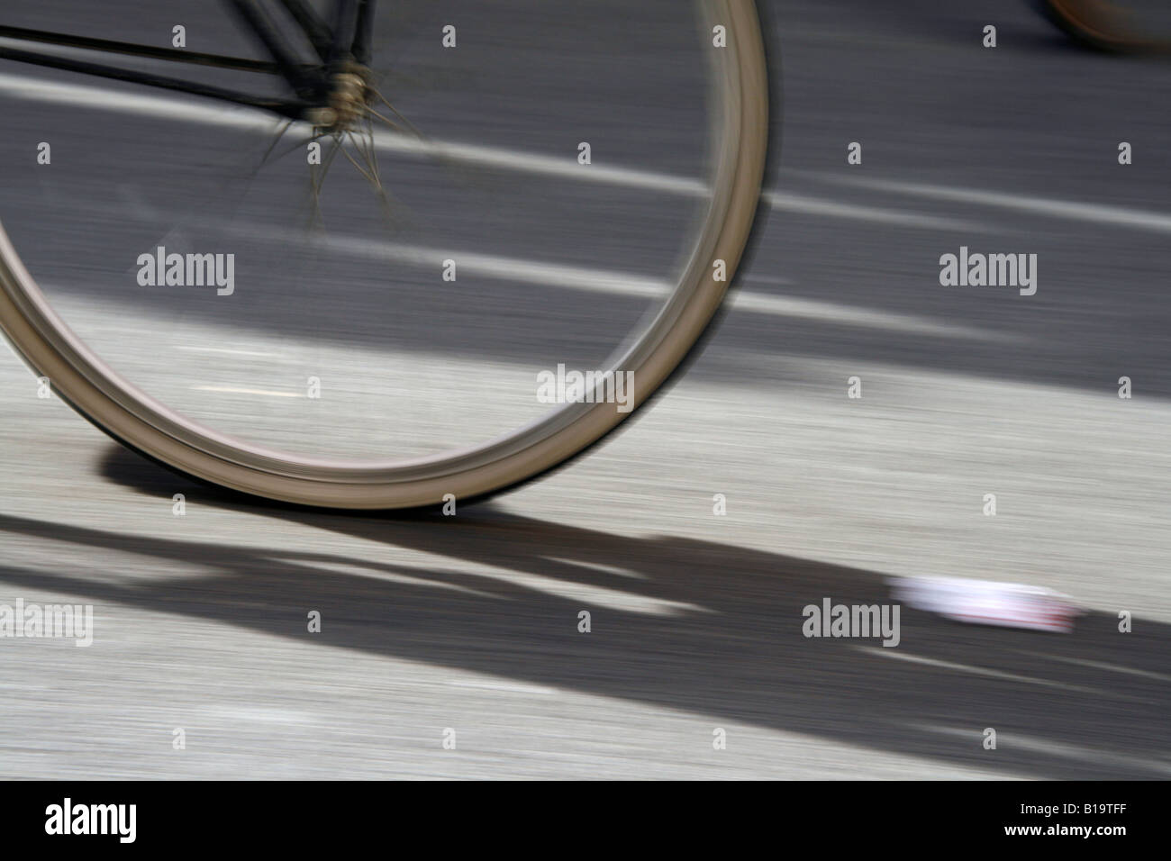 one single fast bike wheel in motion Stock Photo - Alamy
