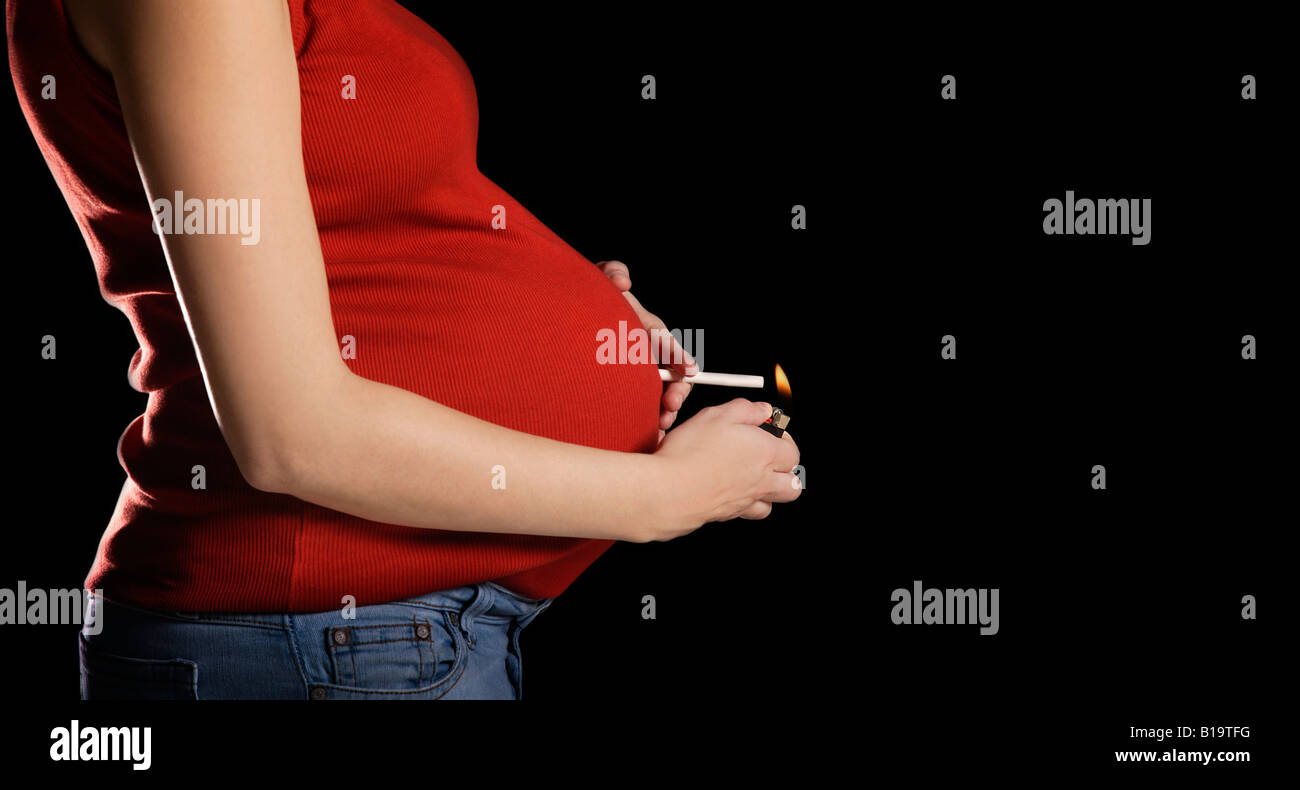 Pregnate Woman Lighting A Cigarette