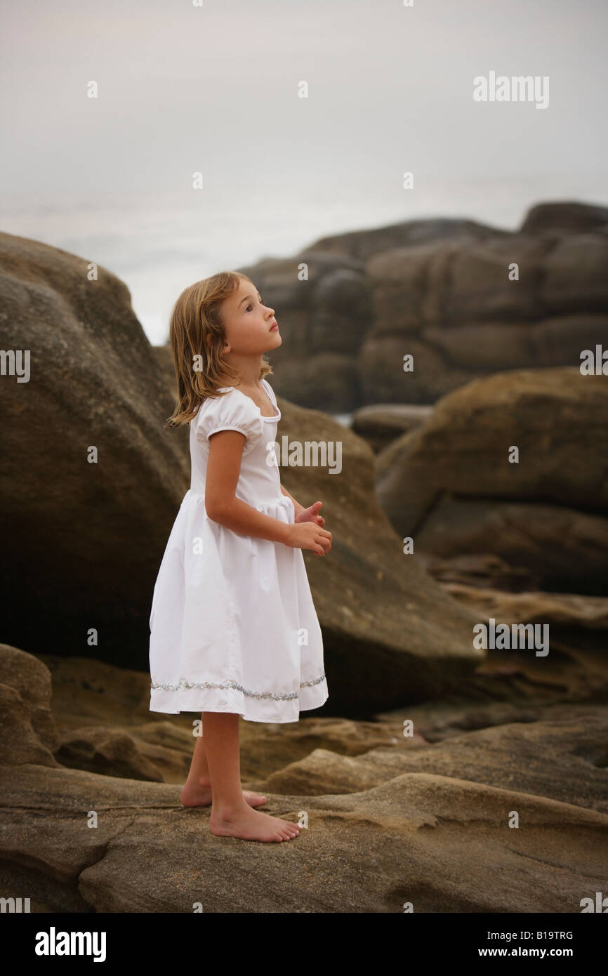 Girl looking upwards Stock Photo - Alamy