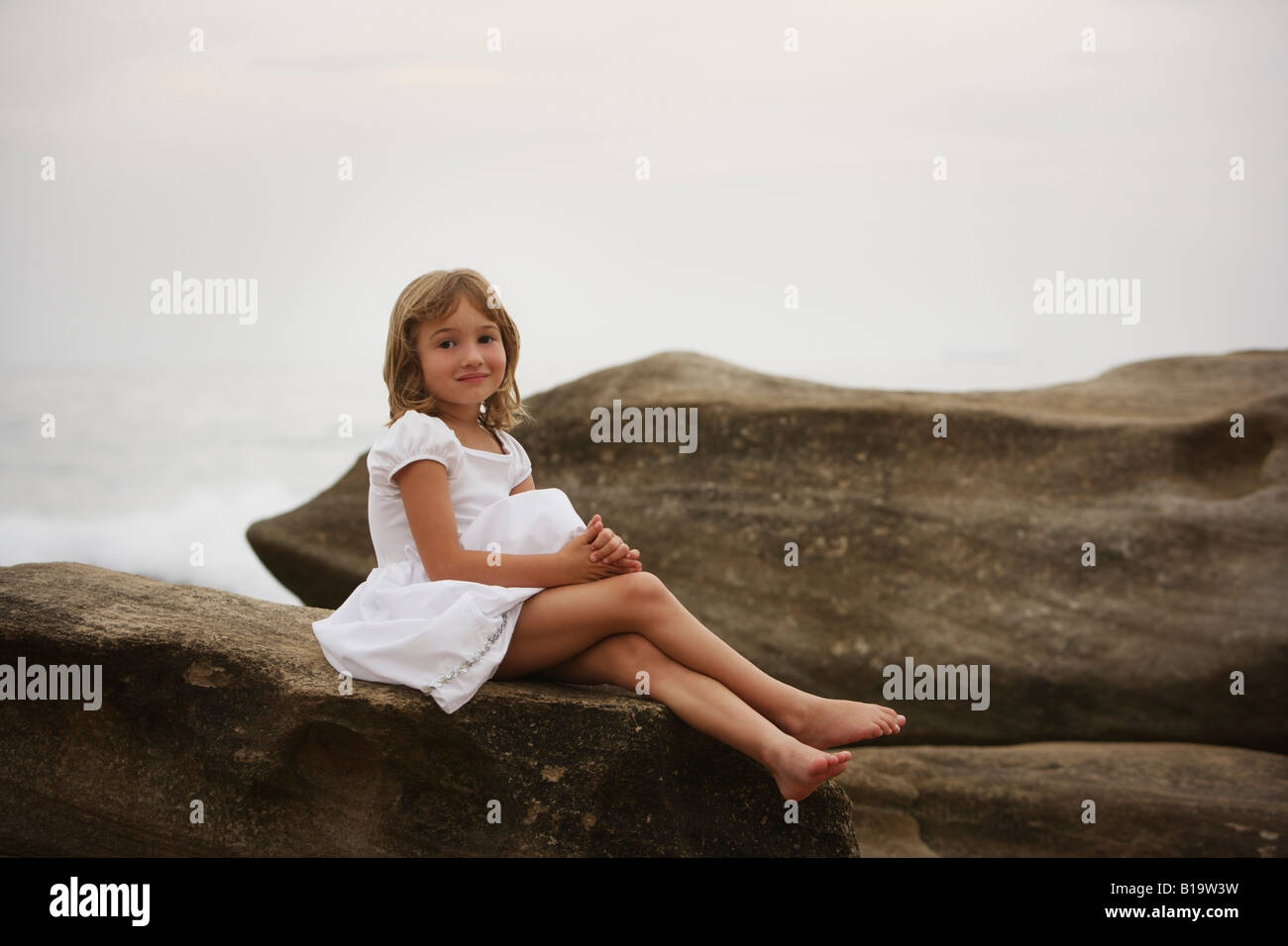 Female posing on rocks hi-res stock photography and images - Alamy